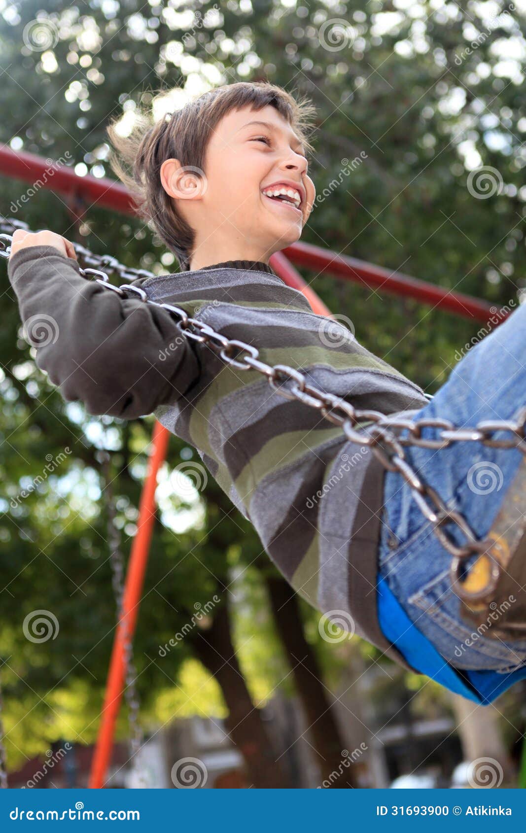 Swinging boy stock photo. Image of happy, cute, green - 31693900