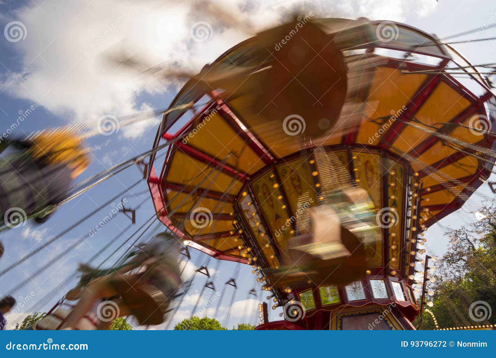 Swinging Ride at a Carnival with Motion Blur Stock Photo - Image of ...