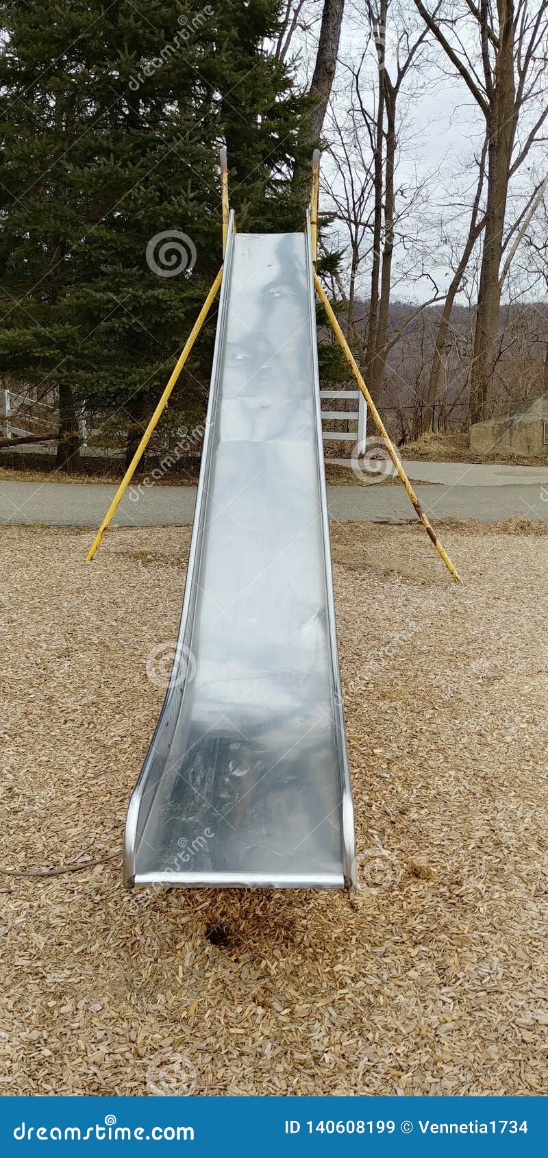 Swings and slides at park stock image. Image of slides - 140608199