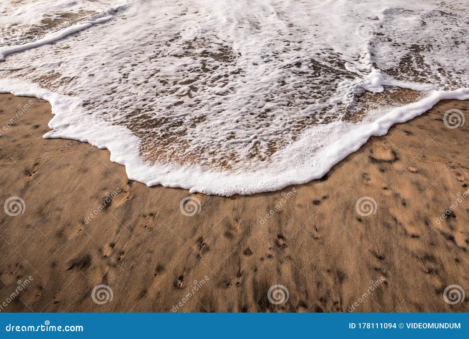 Swirl Pattern of a Wave Rolling Onto Beach Stock Photo - Image of ...