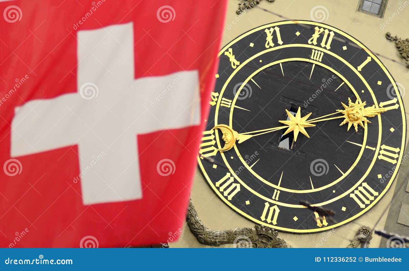 Swiss Flag Front of the Famous Clock Tower in Bern, Switzerland. Stock ...