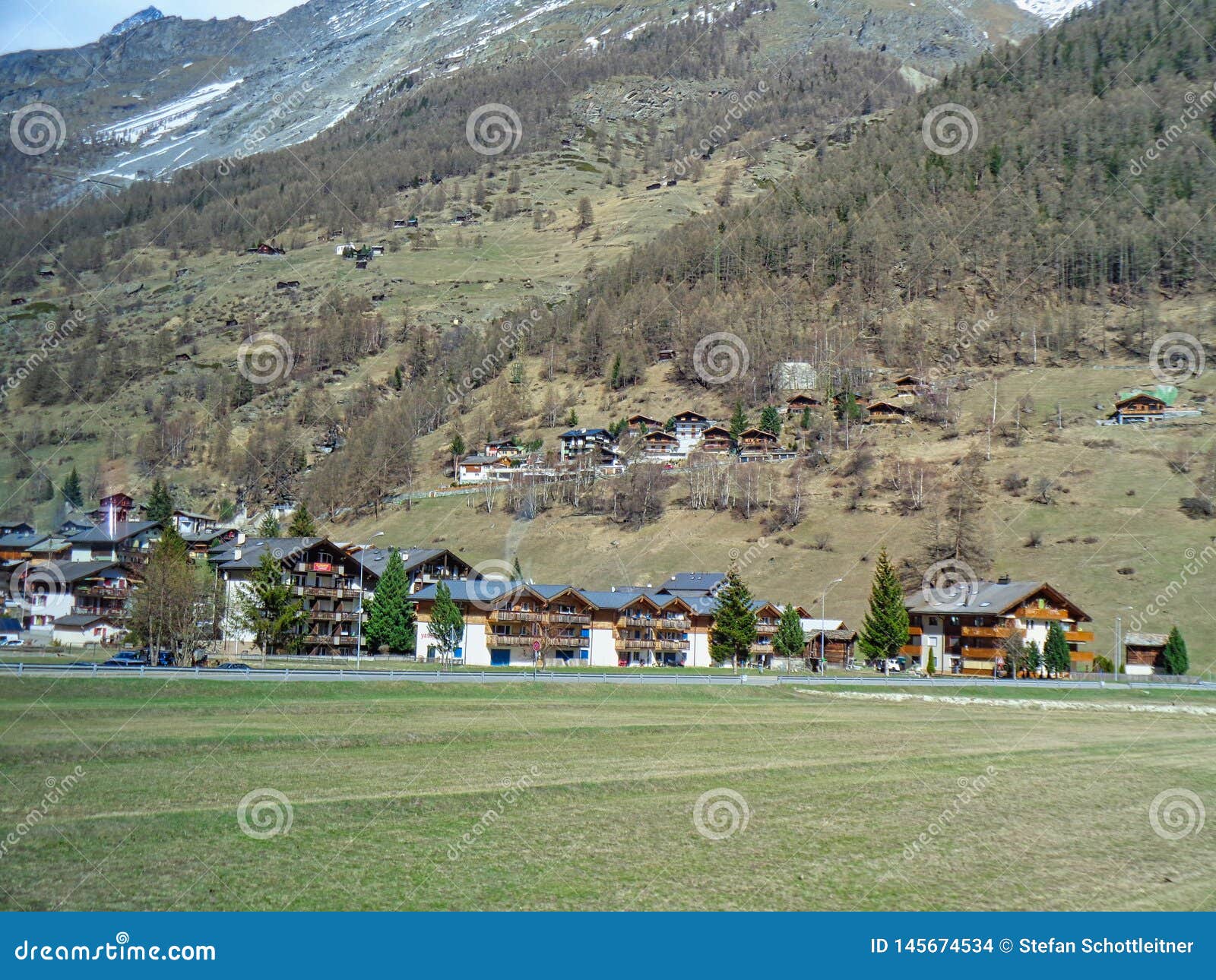Swiss houses in the alps stock photo. Image of background - 145674534