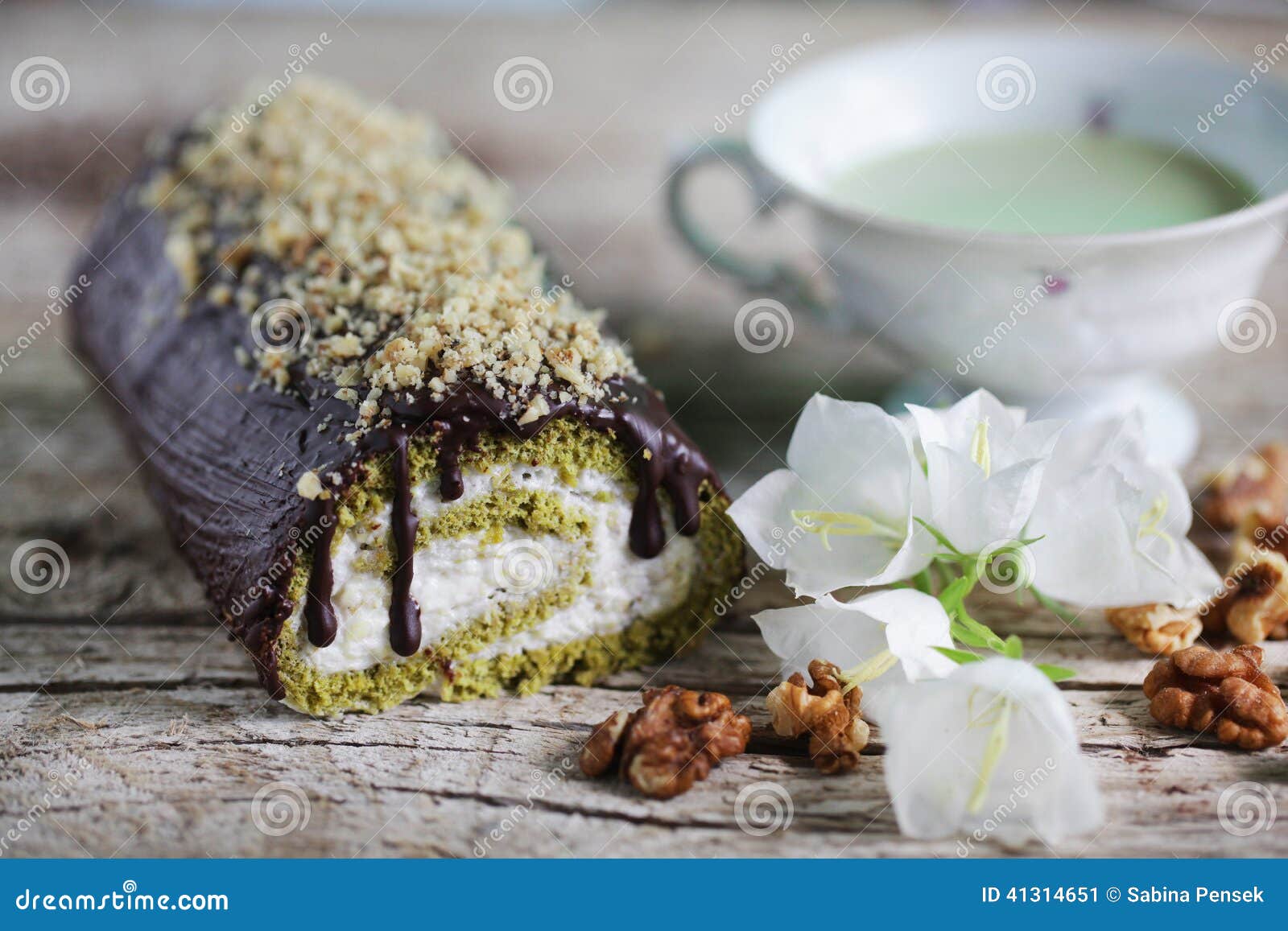Swiss Roll with Matcha Tea and Chocolate Icing Filled with Cream Stock ...