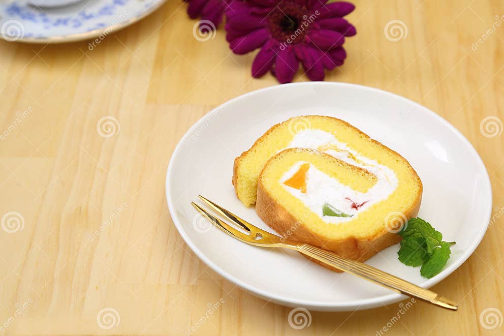 Swiss roll on a plate stock image. Image of break, studio - 60307969