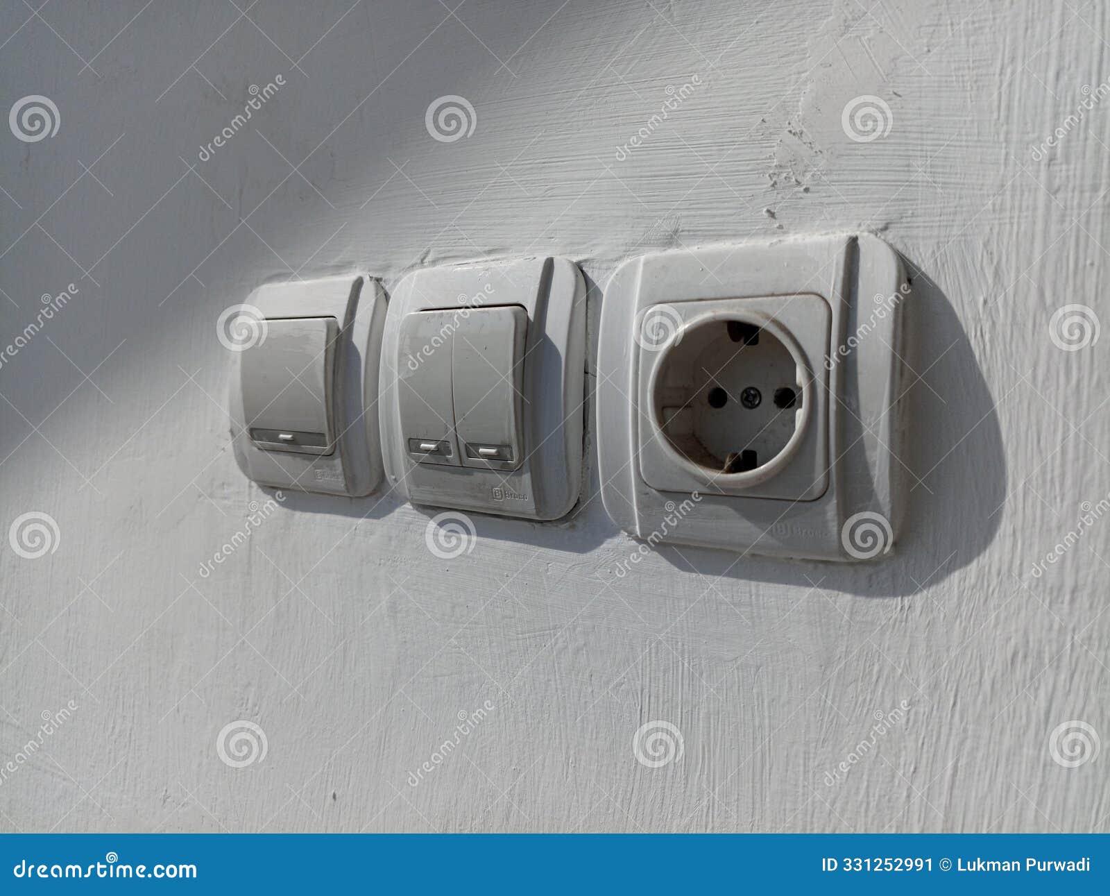 Switch and Electrical Socket on the Outside Wall of the House with a ...