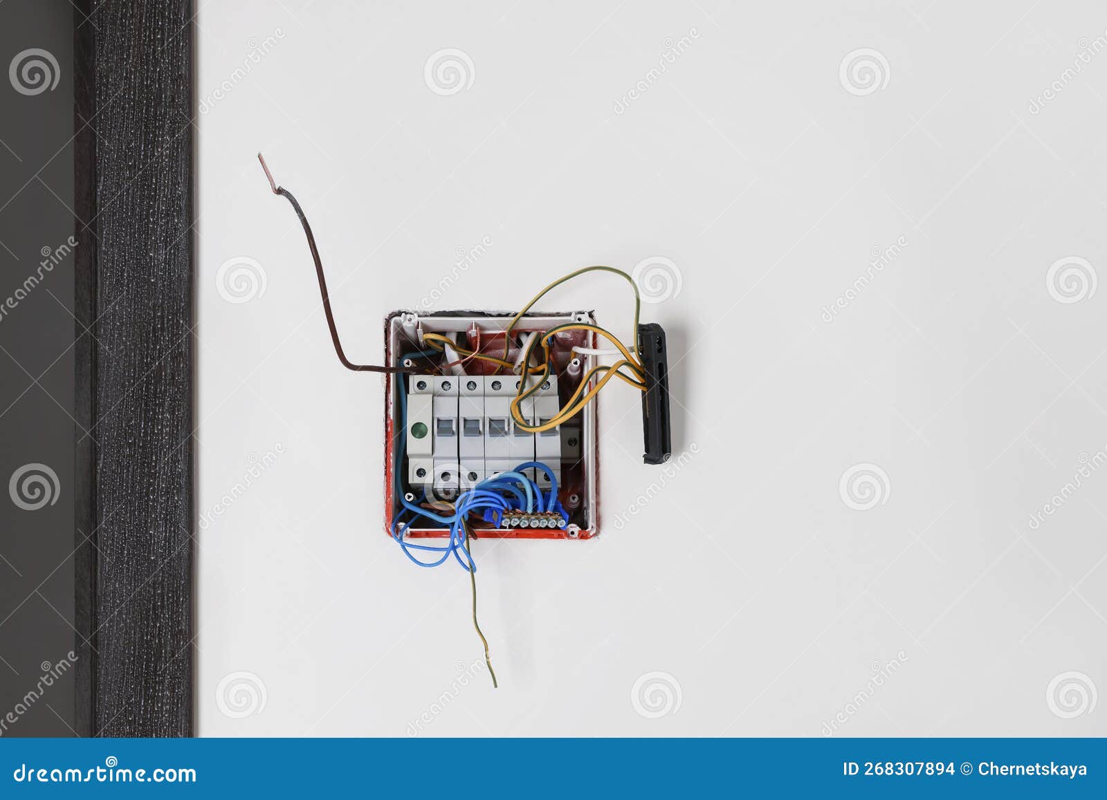 Switchboard with Different Cables on White Wall. Installation of ...