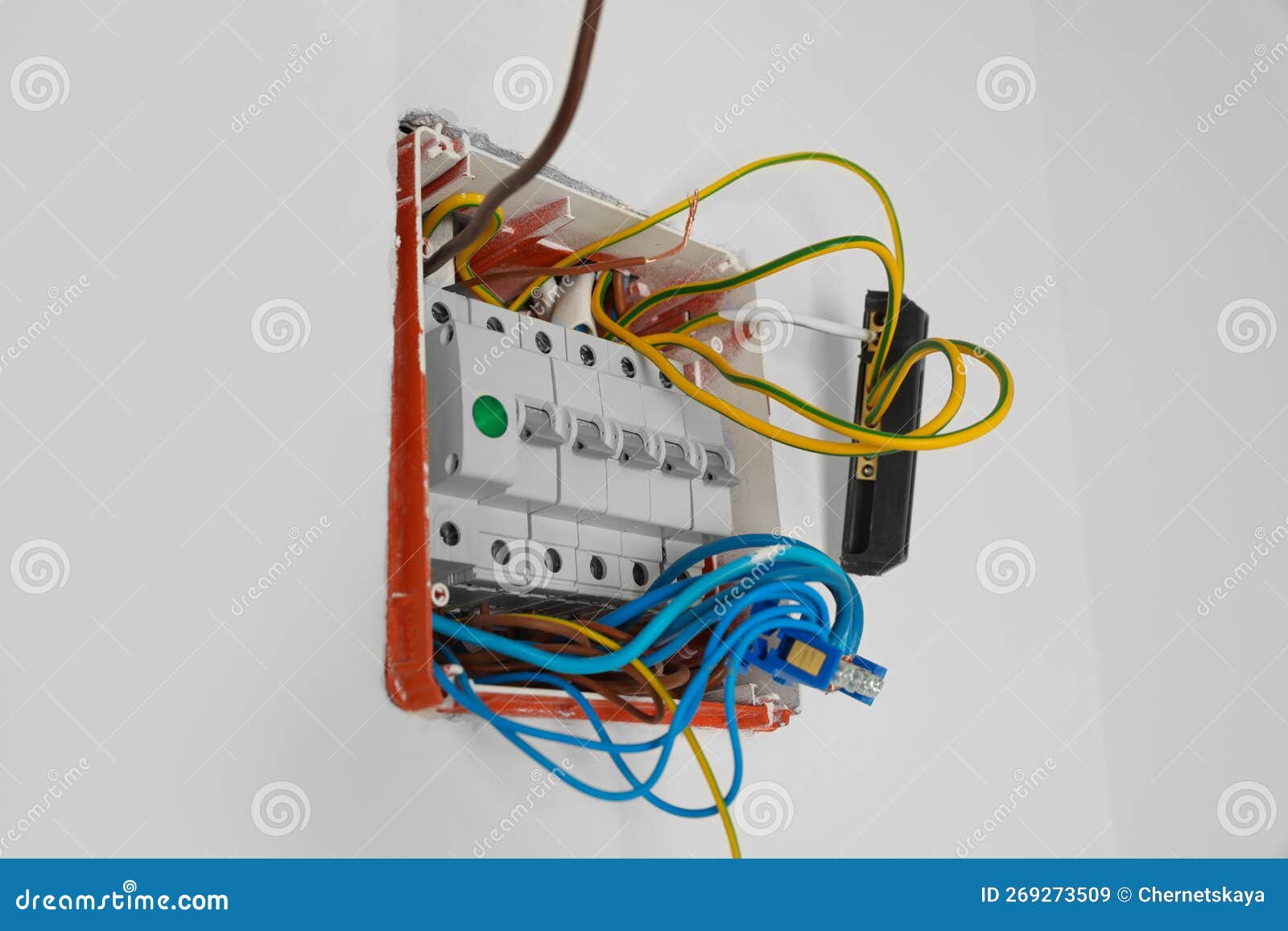 Switchboard with Different Cables on White Wall. Installation of ...