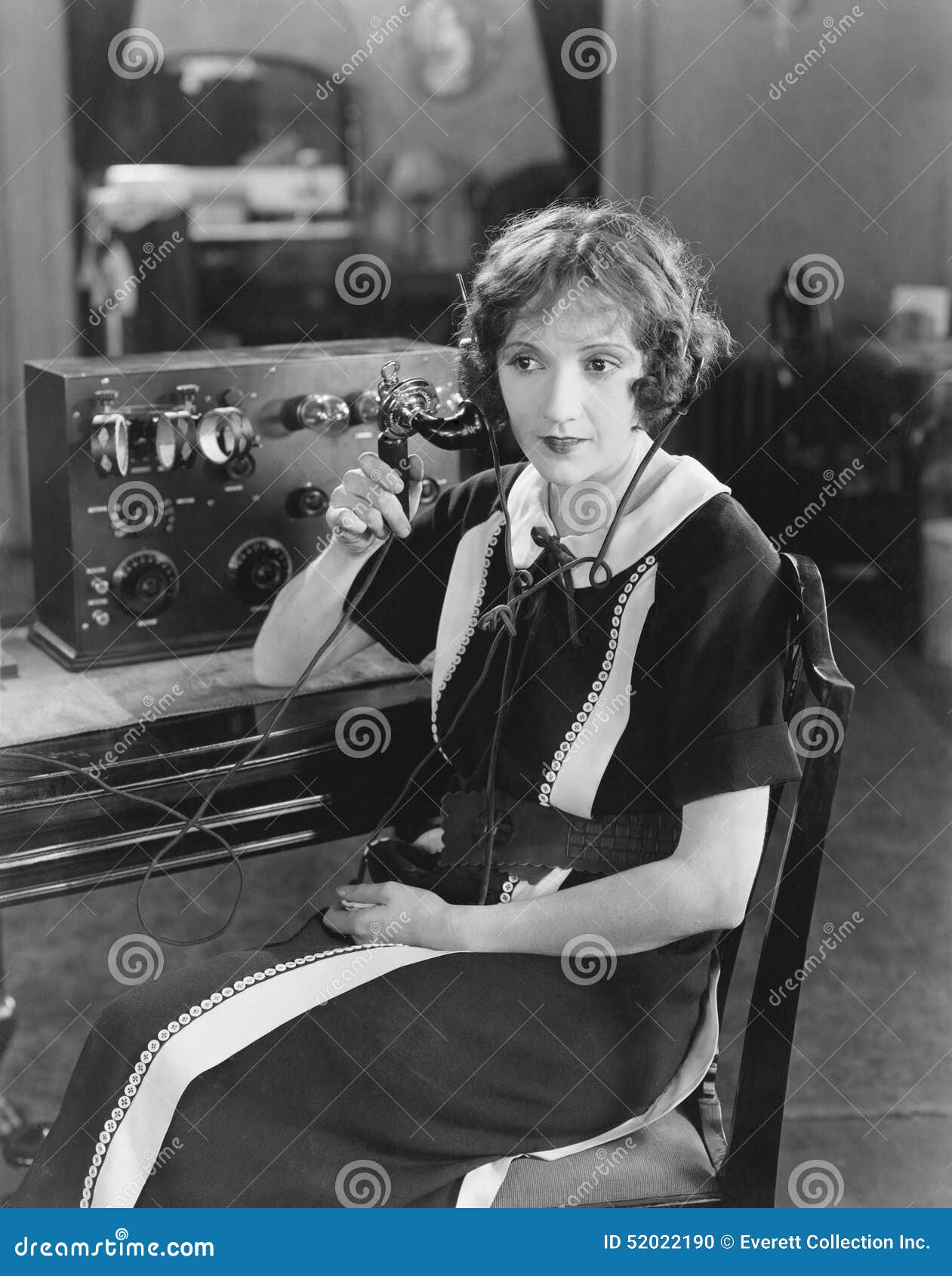 Switchboard Operator Sitting At Telephone Switchboard And Talking Stock ...