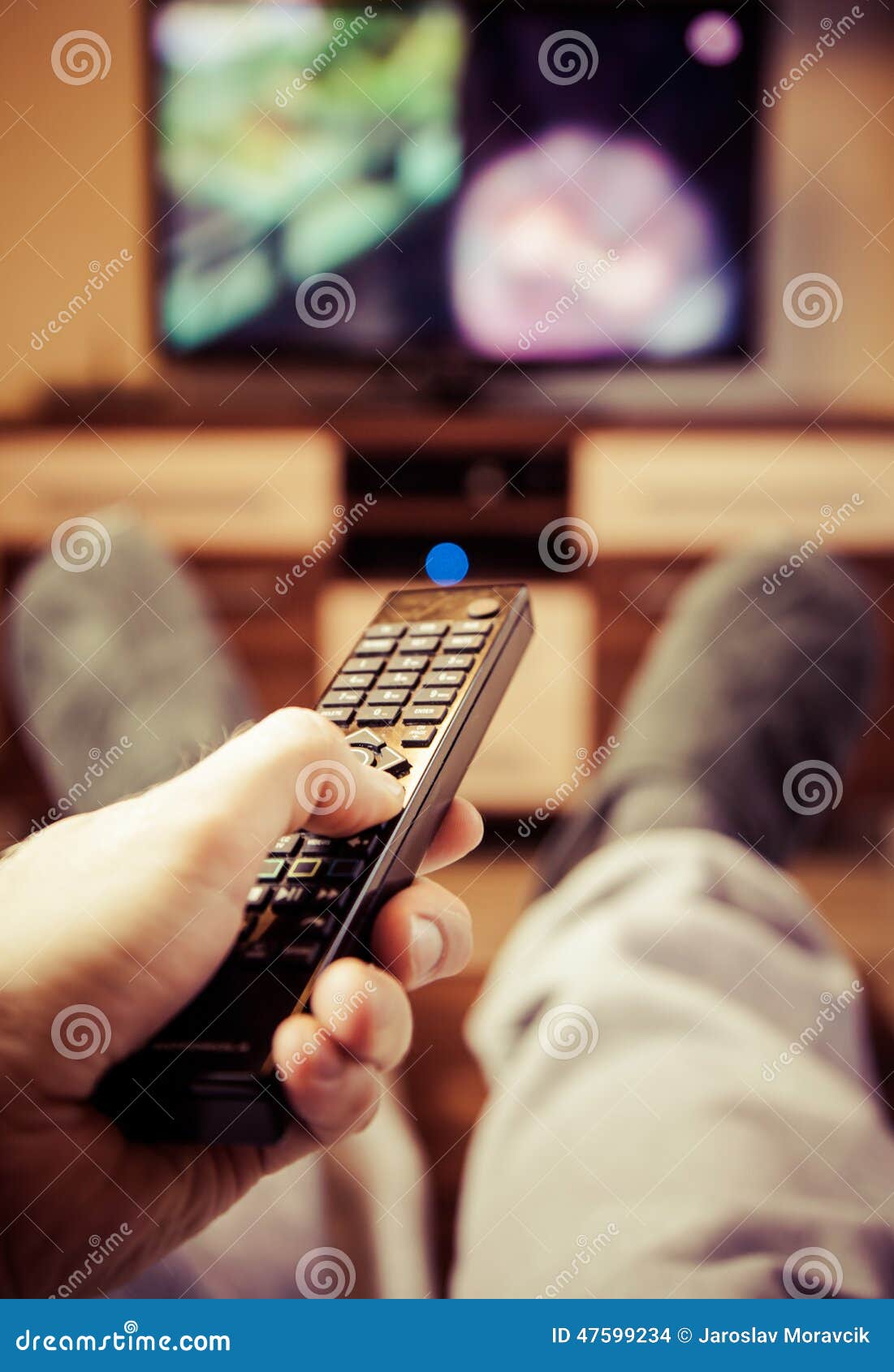 Switching TV channels stock photo. Image of remote, watching - 47599234