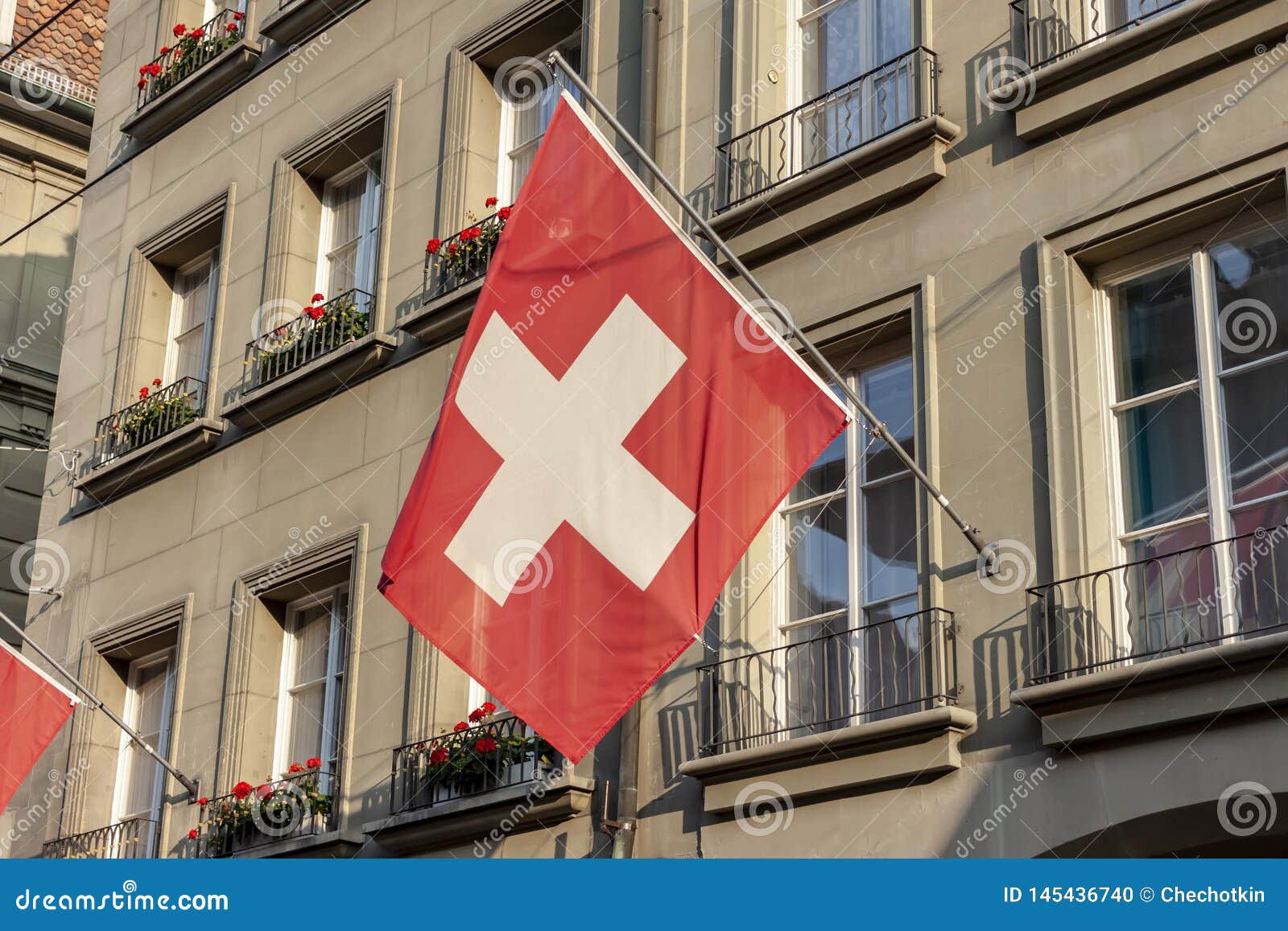 Switzerland Flag Hanging on Building in Bern Stock Photo - Image of ...
