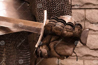 Sword in a hand of knight stock photo. Image of guard - 21855252
