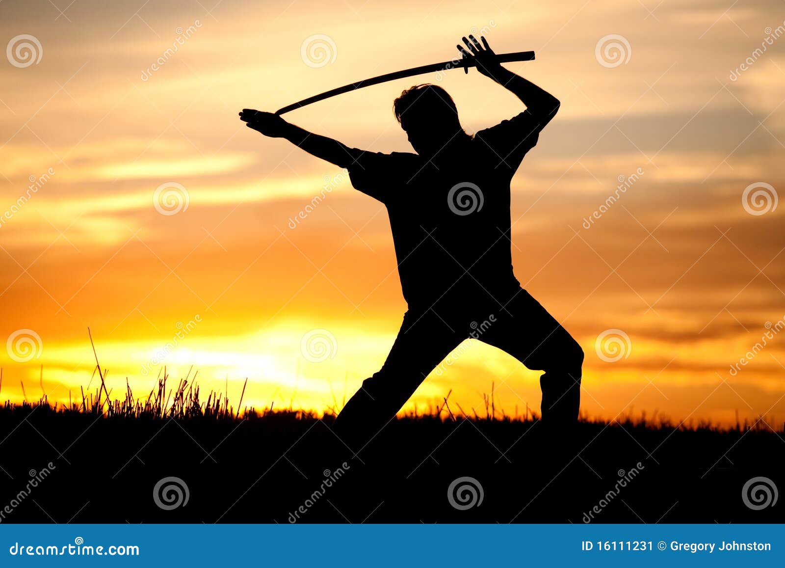 Sword play at sunset. stock image. Image of scenery, beautiful - 16111231
