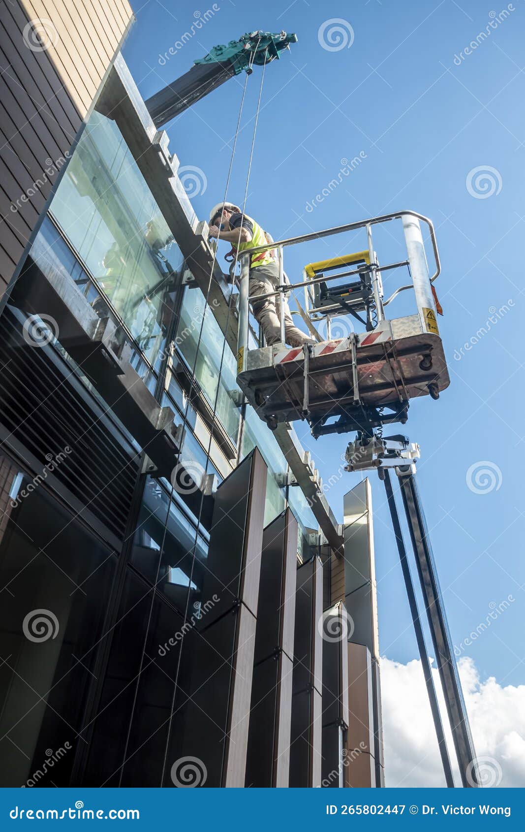 Workman Hoisted Using A Mechanical Crane To A High Level Editorial ...