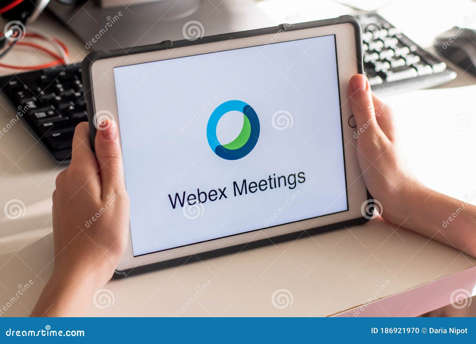 Hands Holding a Tablet with Webex Cloud Meetings Application Editorial ...