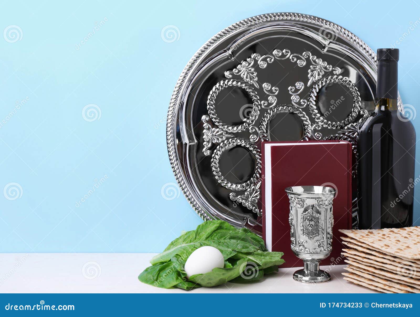 Symbolic Pesach Passover Seder Items on Table Against Light Blue ...