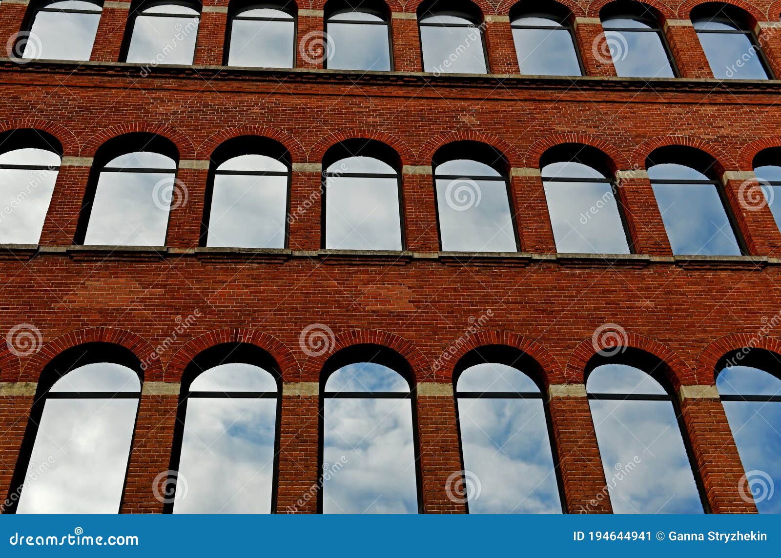 Symmetrical Windows on the Brick Wall of the Building. Stock Image ...
