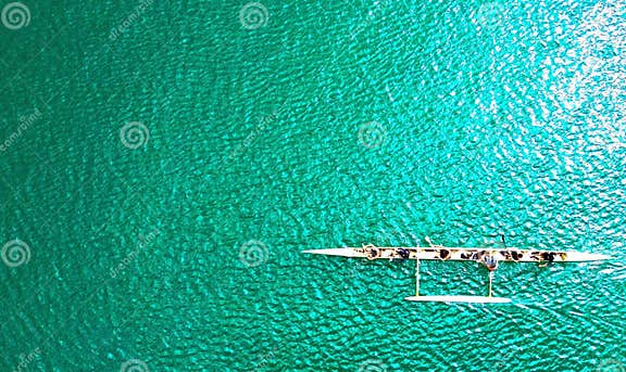 Synchronized Effort: Team Canoe Rowing on Serene Waters Editorial Stock ... Synchronized Effort: Team Canoe Rowing on Serene Waters Editorial Stock ...