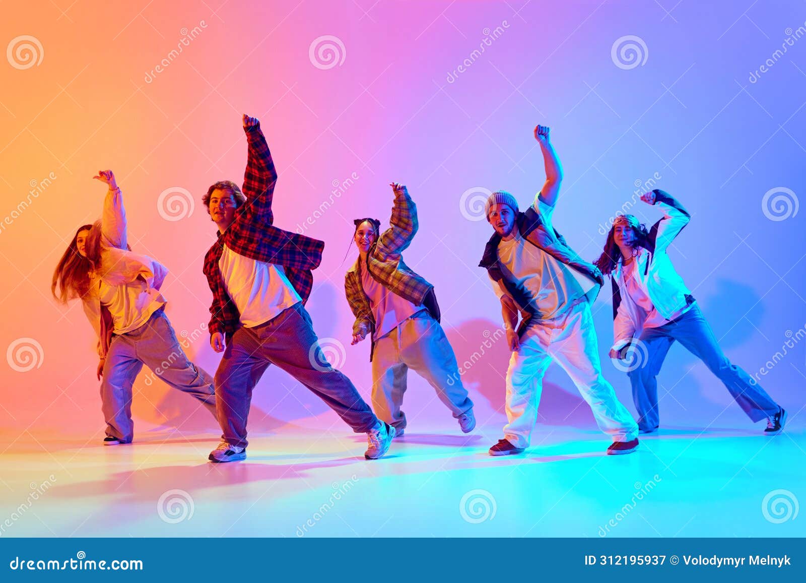Synchronized Movements. Group of Young People Dancing Contemp Against ...