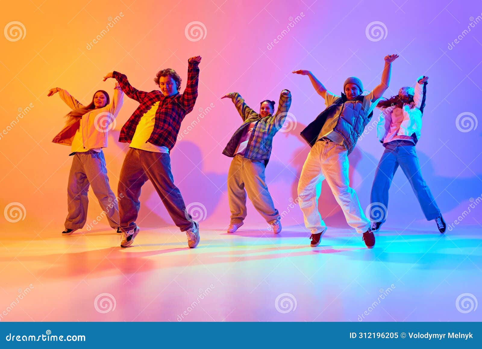 Synchronized Movements. Group of Young People Dancing Contemp Against ...