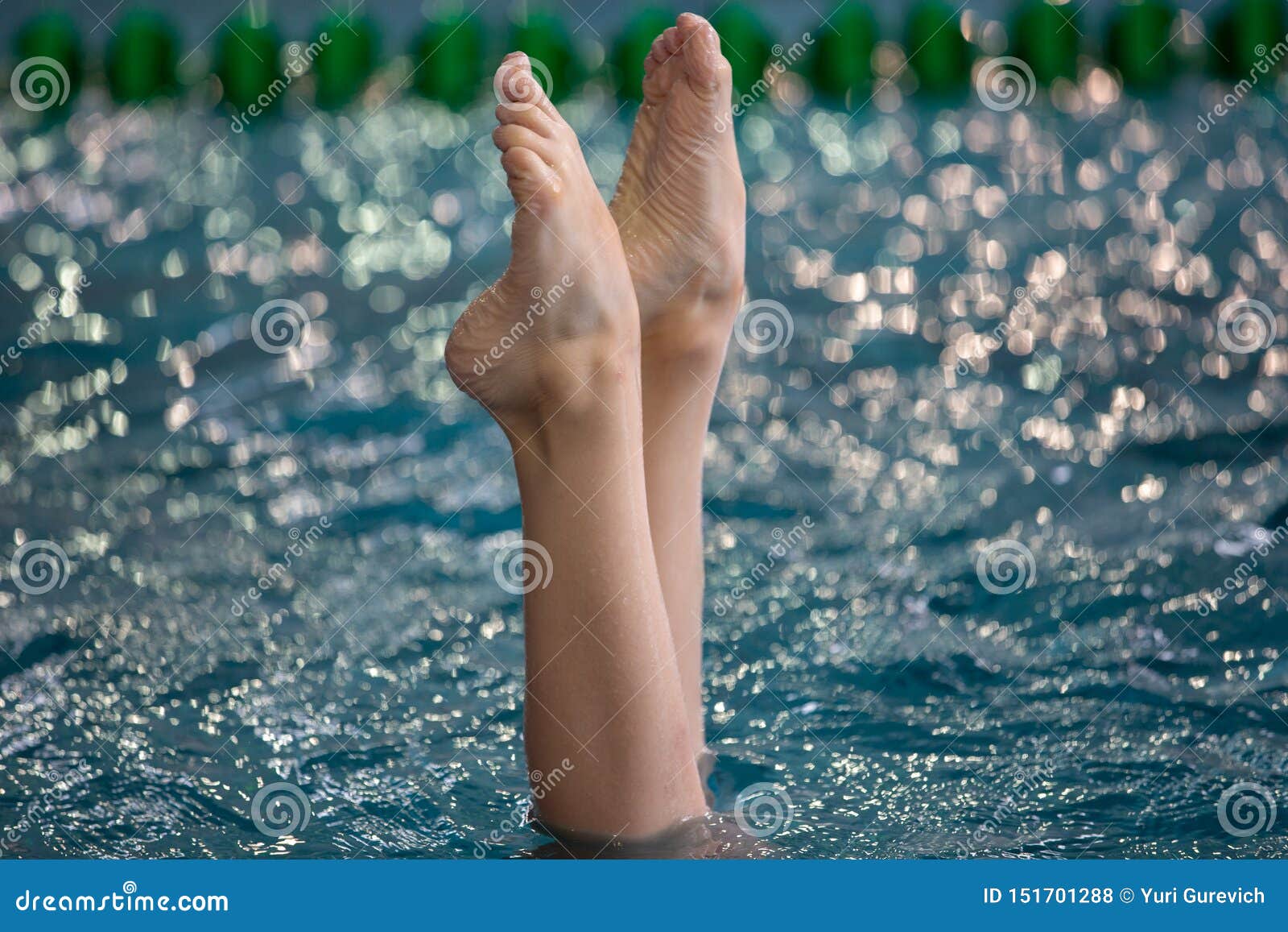 Synchronized Swimmers Point Up Out of the Water in Action. Synchronized ... Synchronized Swimmers Point Up Out of the Water in Action. Synchronized ...