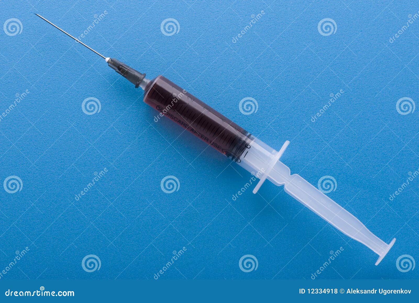 Syringe on blue stock photo. Image of medical, heap, pill - 12334918