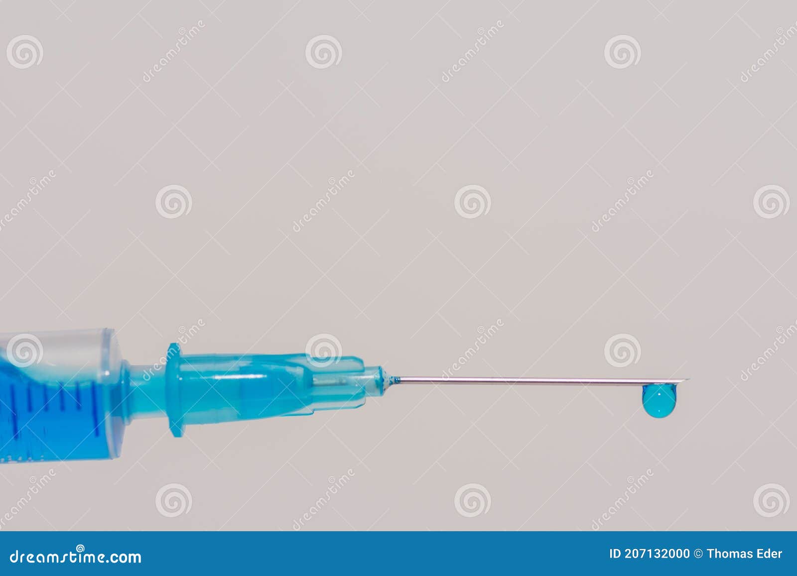 Syringe with a Blue Fluid Vaccine and a Drop on the Front Bottom View ...