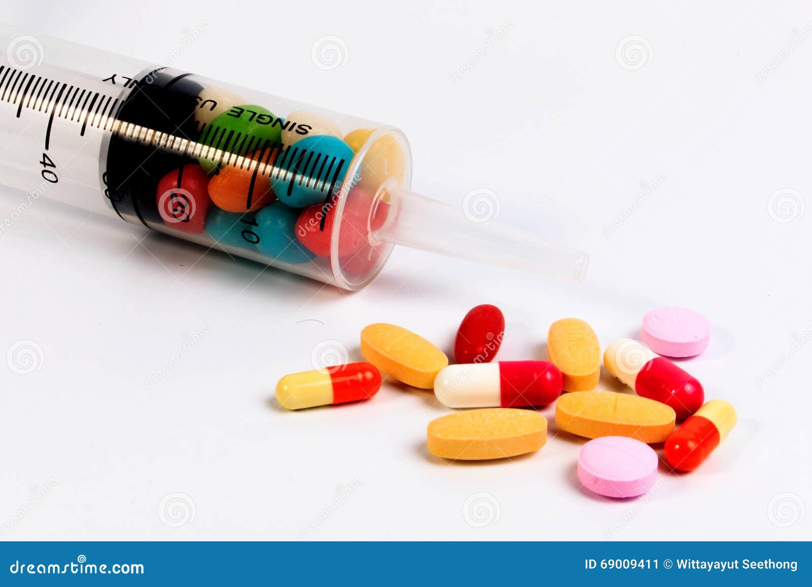 A Syringe and Candy Bottle Isolate on White Background. Stock Image ...