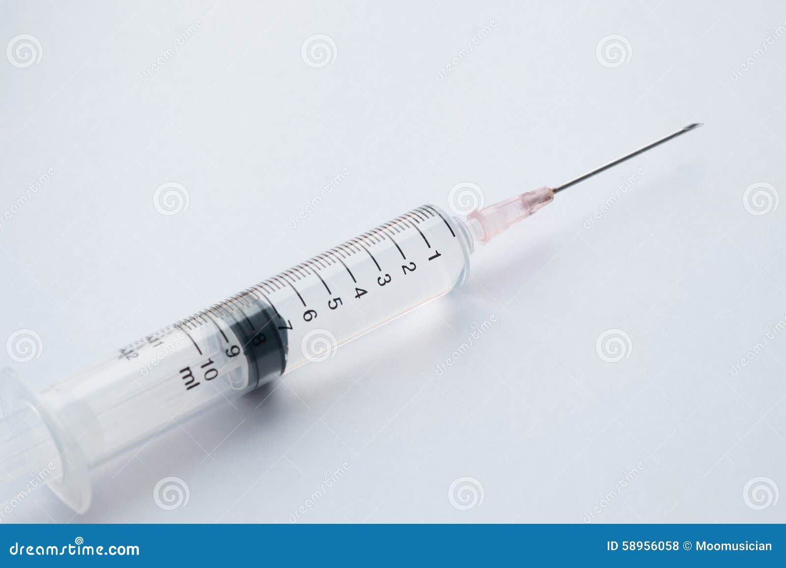 Syringe with clear liquid stock photo. Image of medical - 58956058
