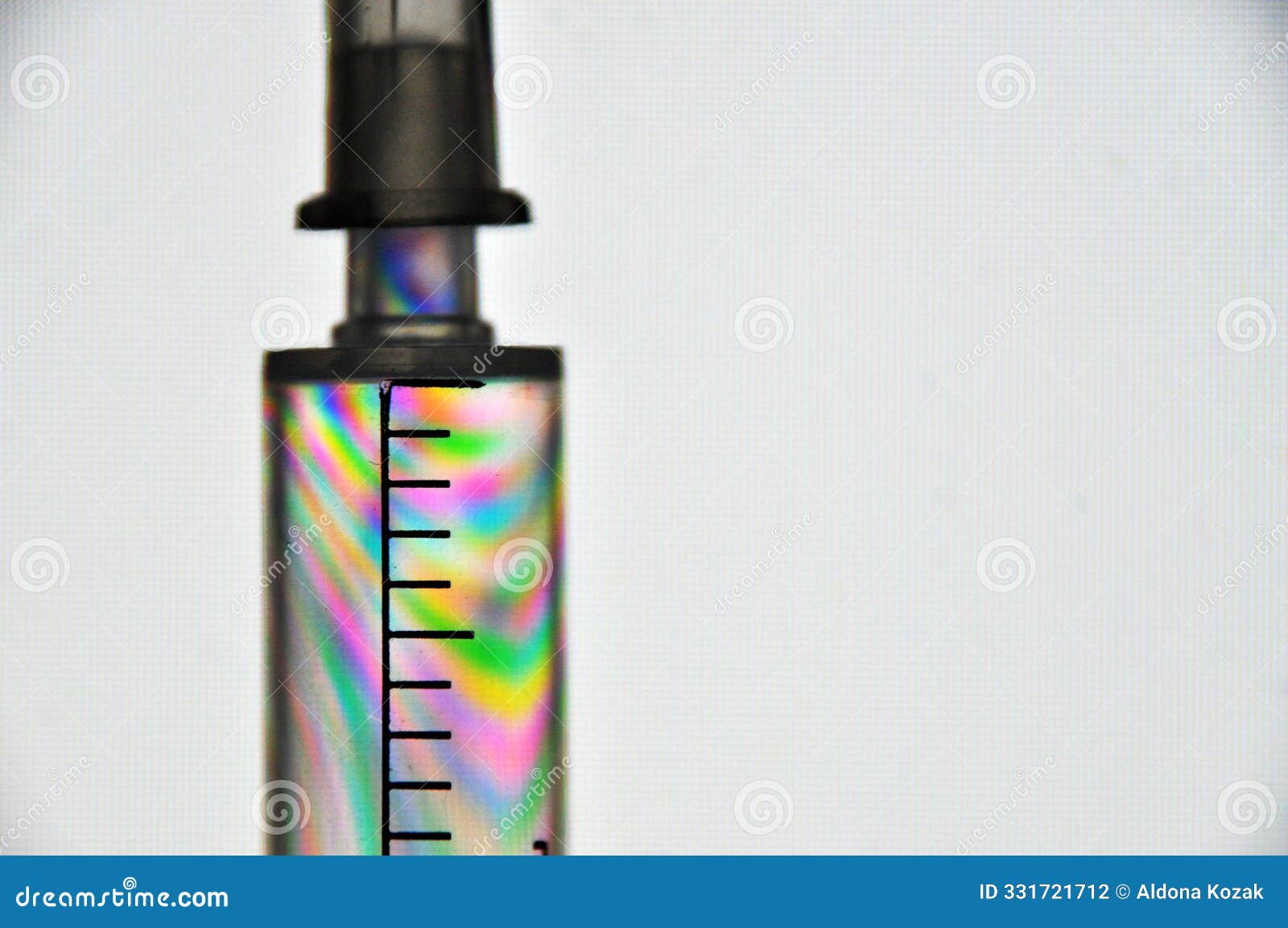 A Syringe with Colorful Rainbow Liquid Inside, an Injection with a ...