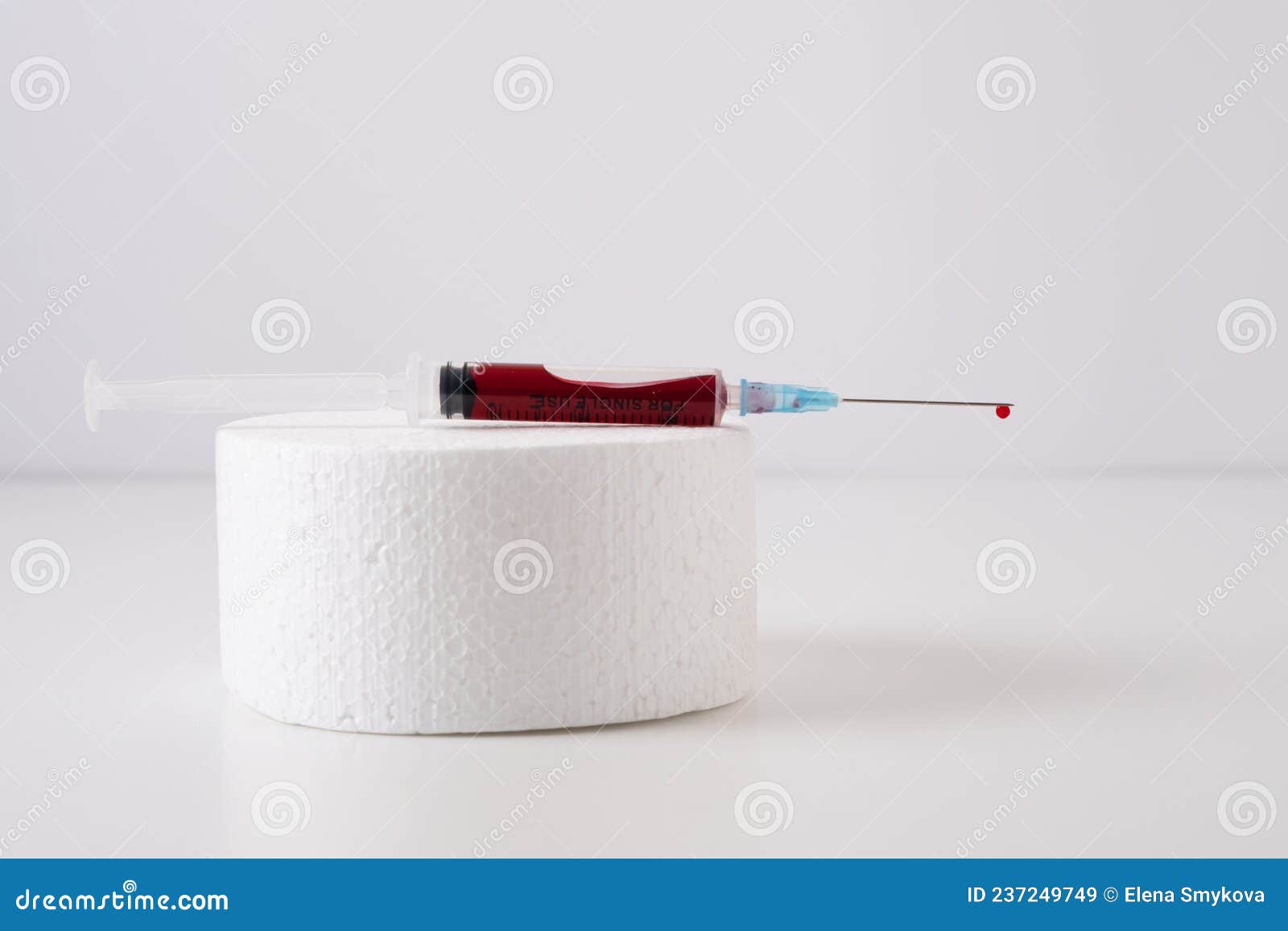 A Syringe Filled with Blood with a Drop of Blood Stock Image - Image of ...