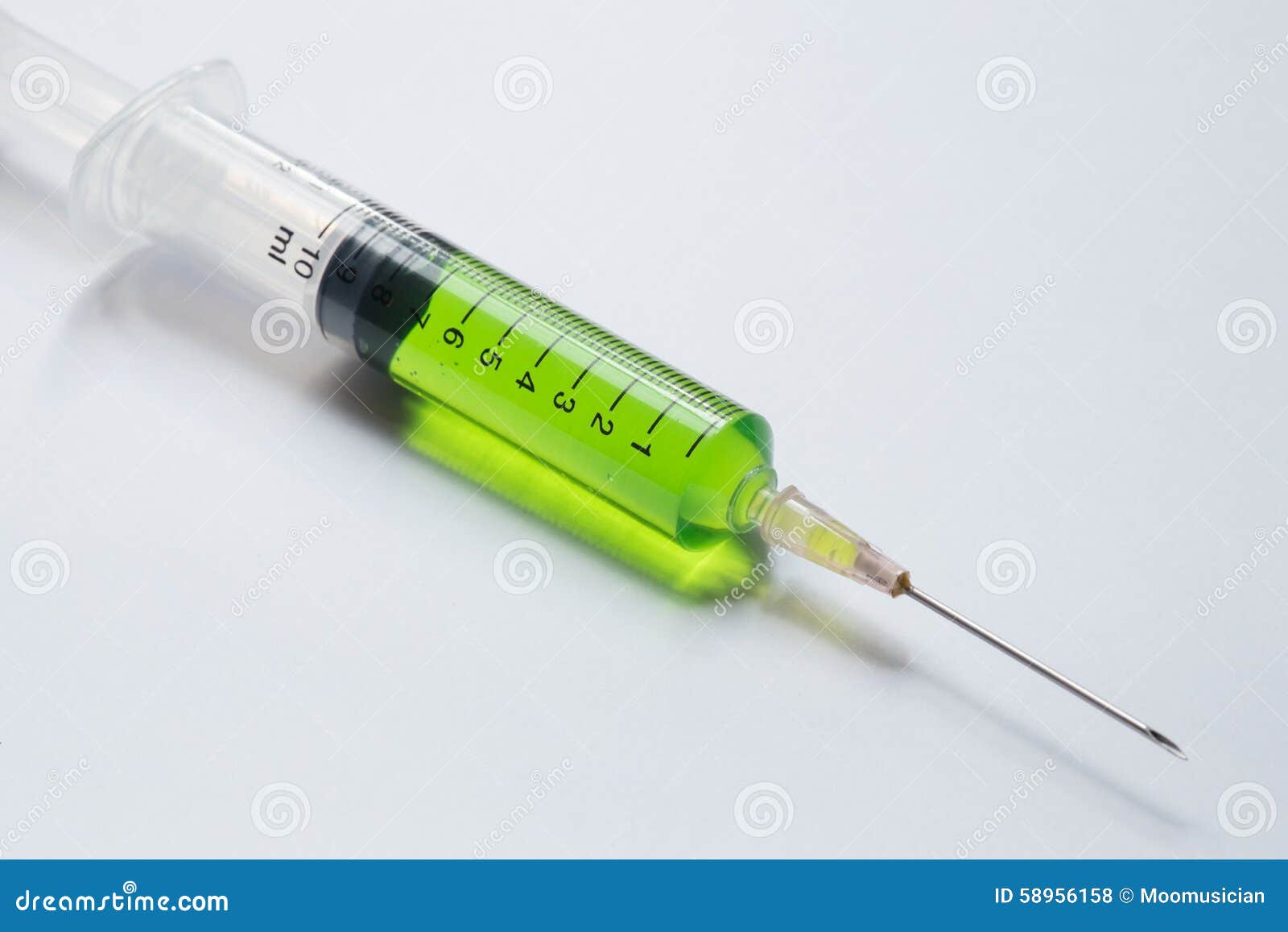 Syringe with green liquid stock photo. Image of syringe - 58956158