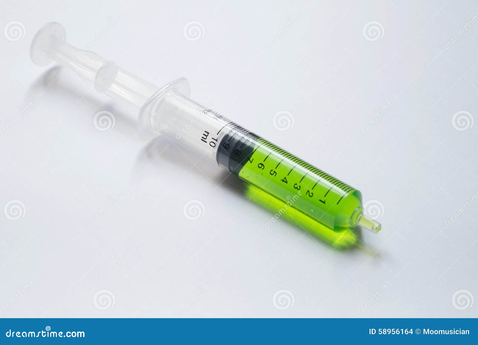 Syringe with green liquid stock photo. Image of syringe - 58956164
