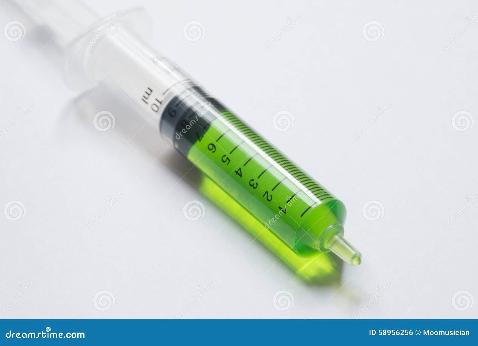Syringe with green liquid stock photo. Image of laboratory - 58956256
