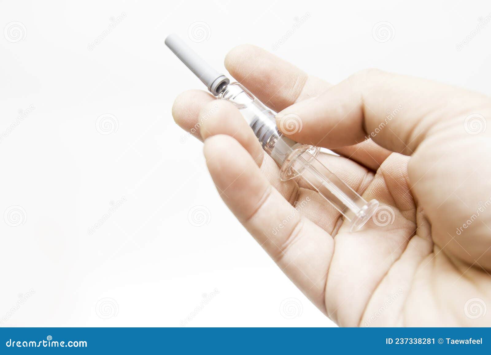 Syringe in a hand of men stock image. Image of finger - 237338281