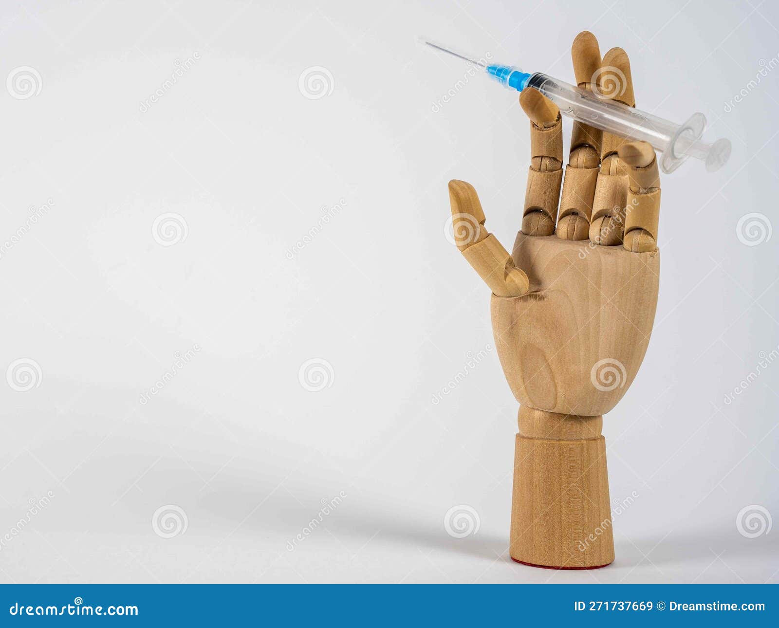 Syringe in Hand Made of Wood on a White Background Stock Image - Image ...