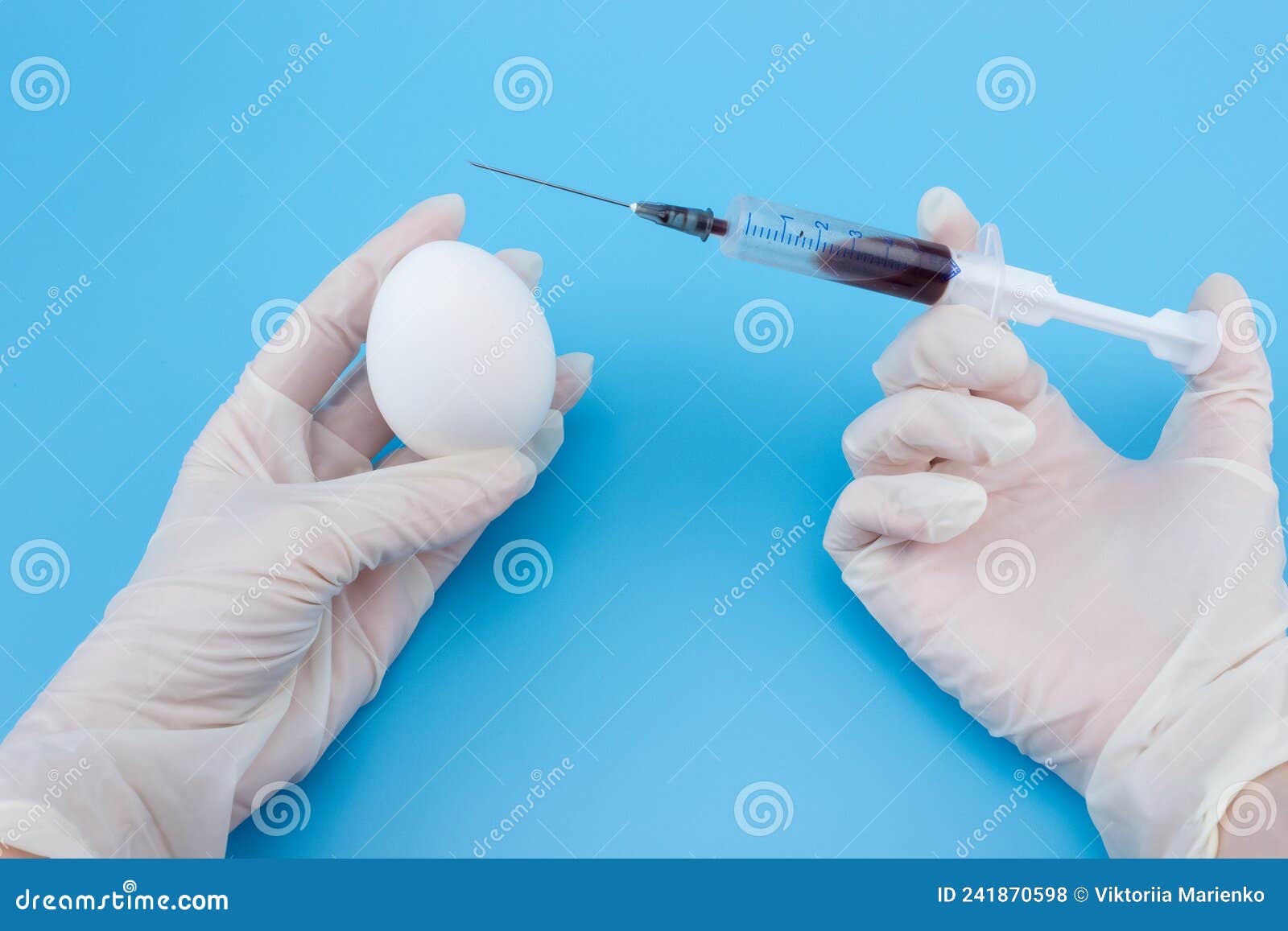 The Syringe is Injected into the Egg. Scientific Experiment Stock Photo ...