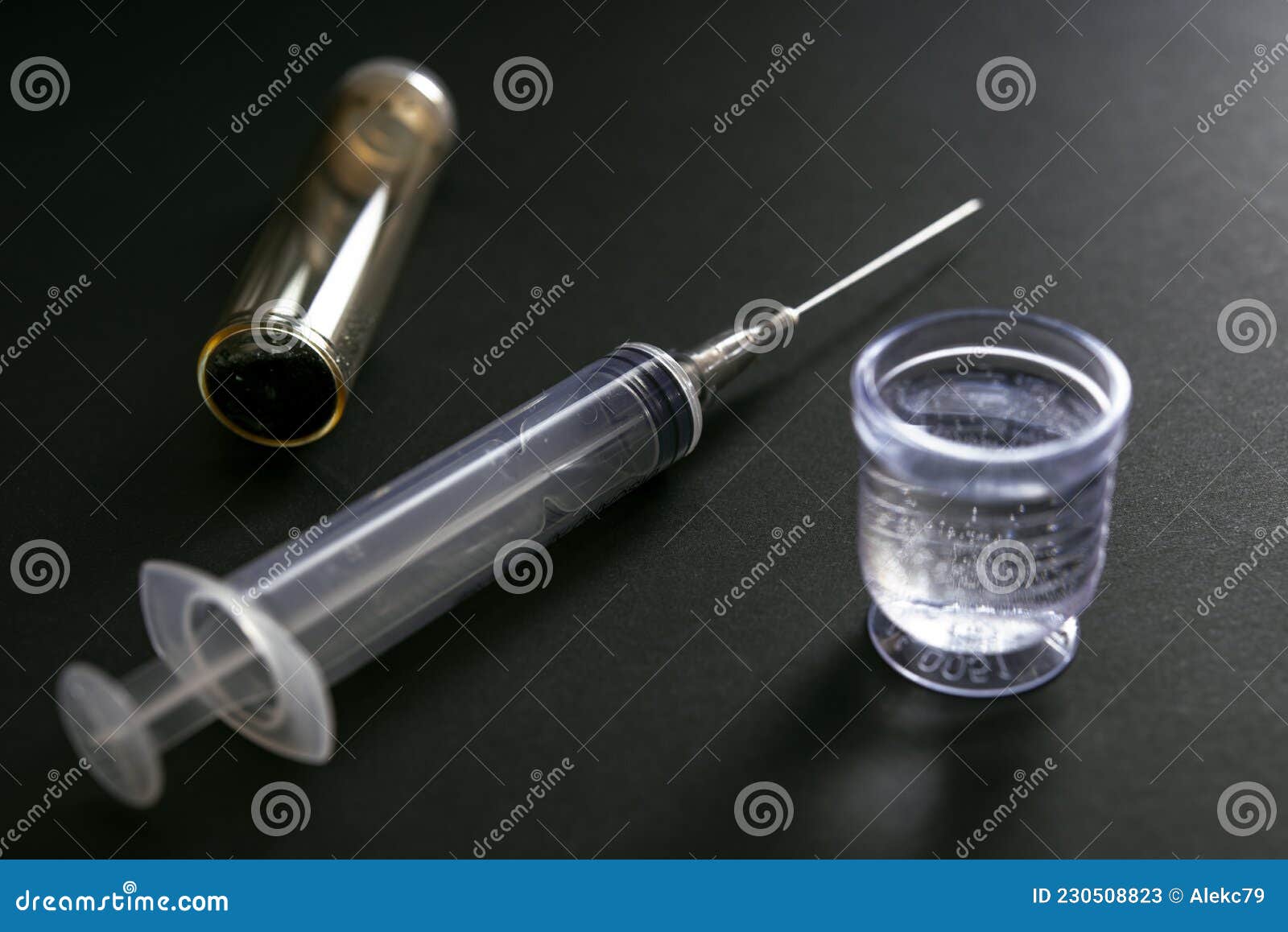 Syringe with Liquid Medicine Container on Black Stock Image - Image of ...