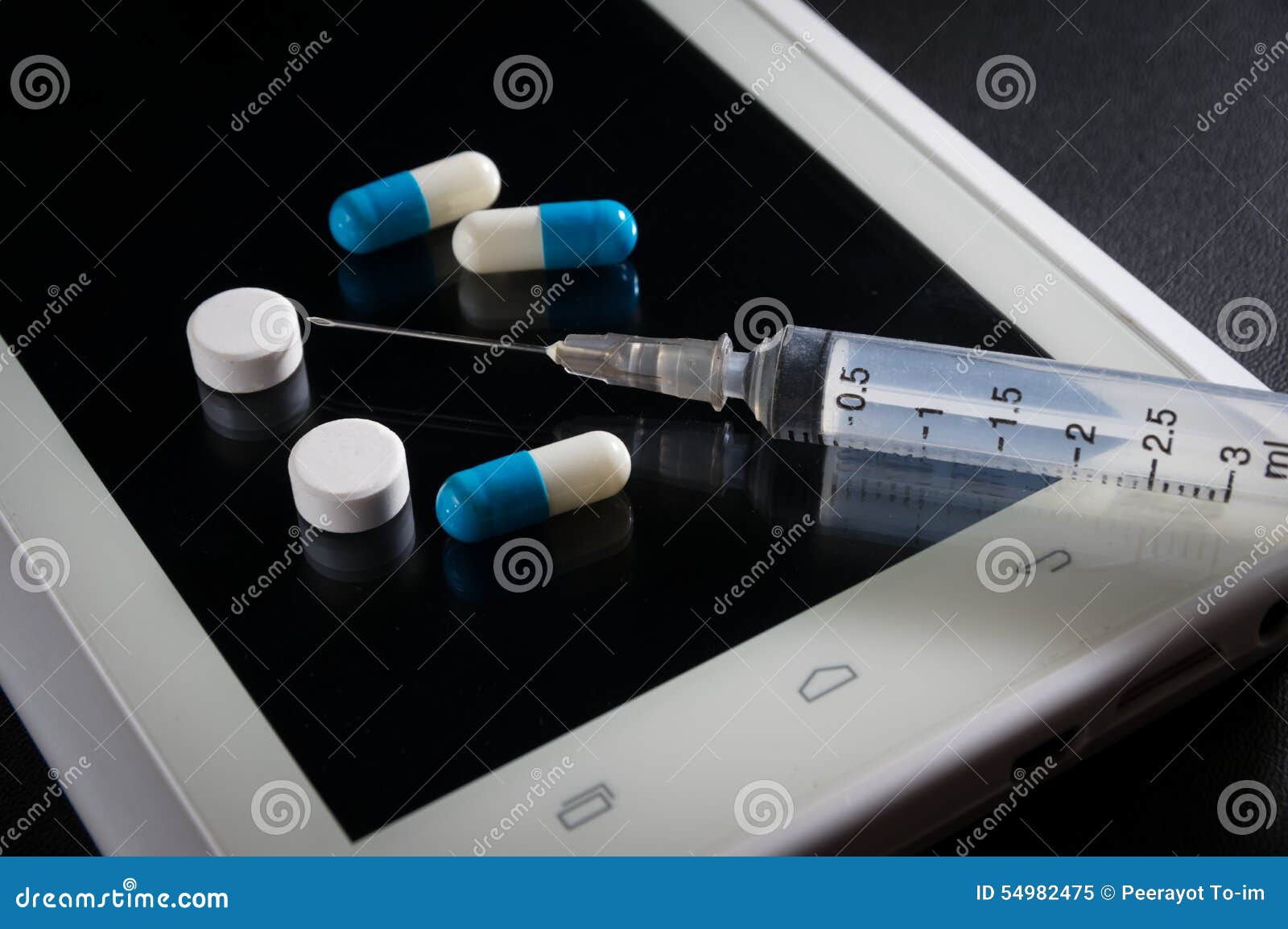 Syringe with Medicine Pills and Capsule on Computer Tablet. Stock Image ...