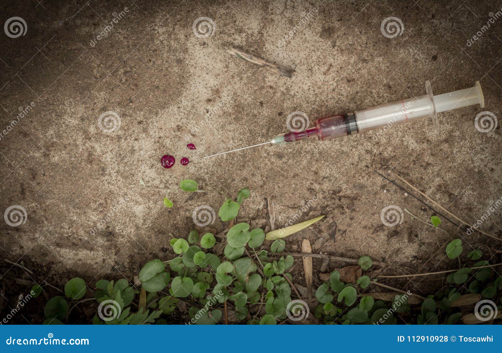 Syringe and Needle with Blood Outdoors on Pavement - Conceptual Stock ...