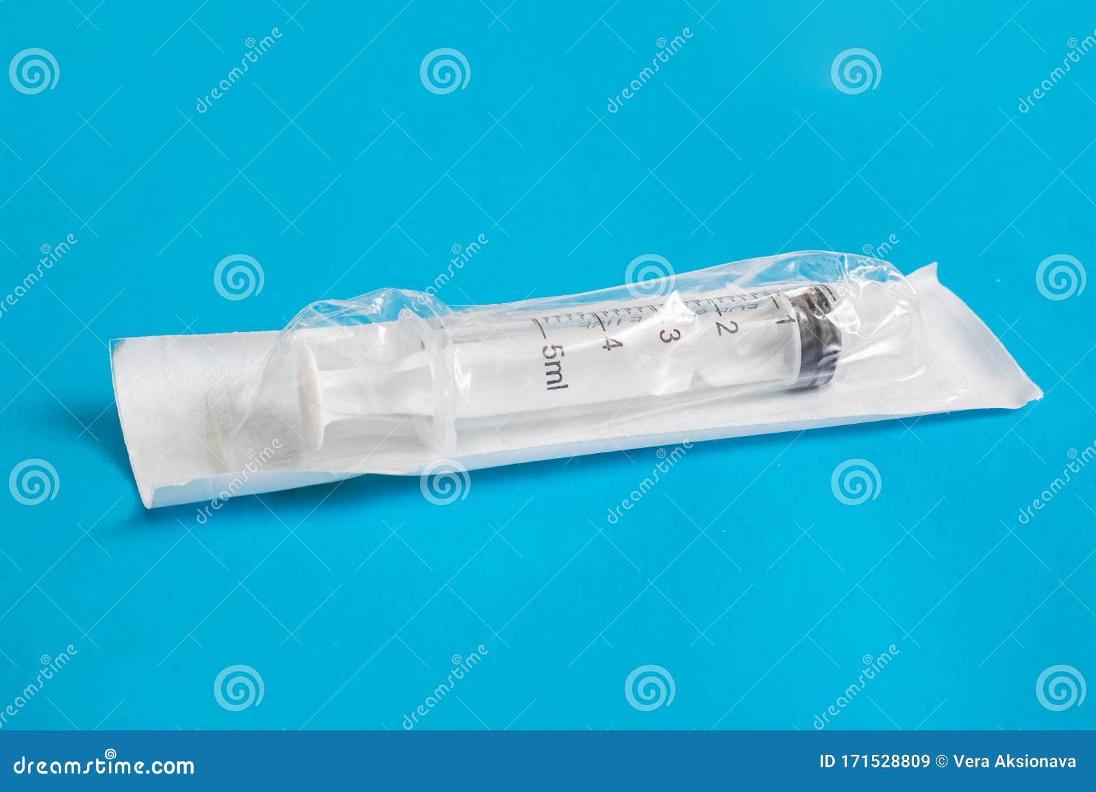 Syringe in the Package on Blue Background Stock Image - Image of ...