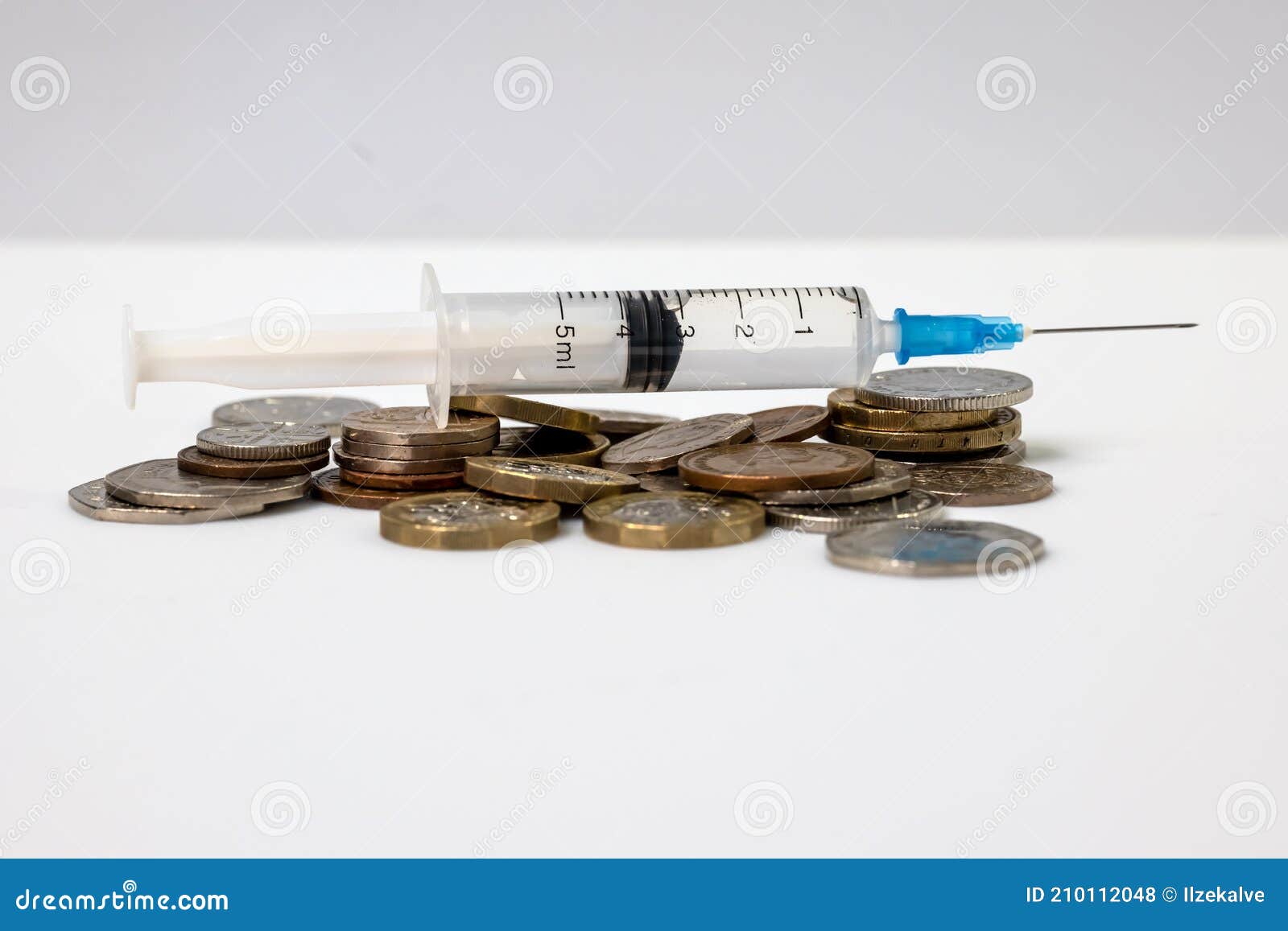 A Syringe Placed on Top of Money Stock Photo - Image of coronavirus ...