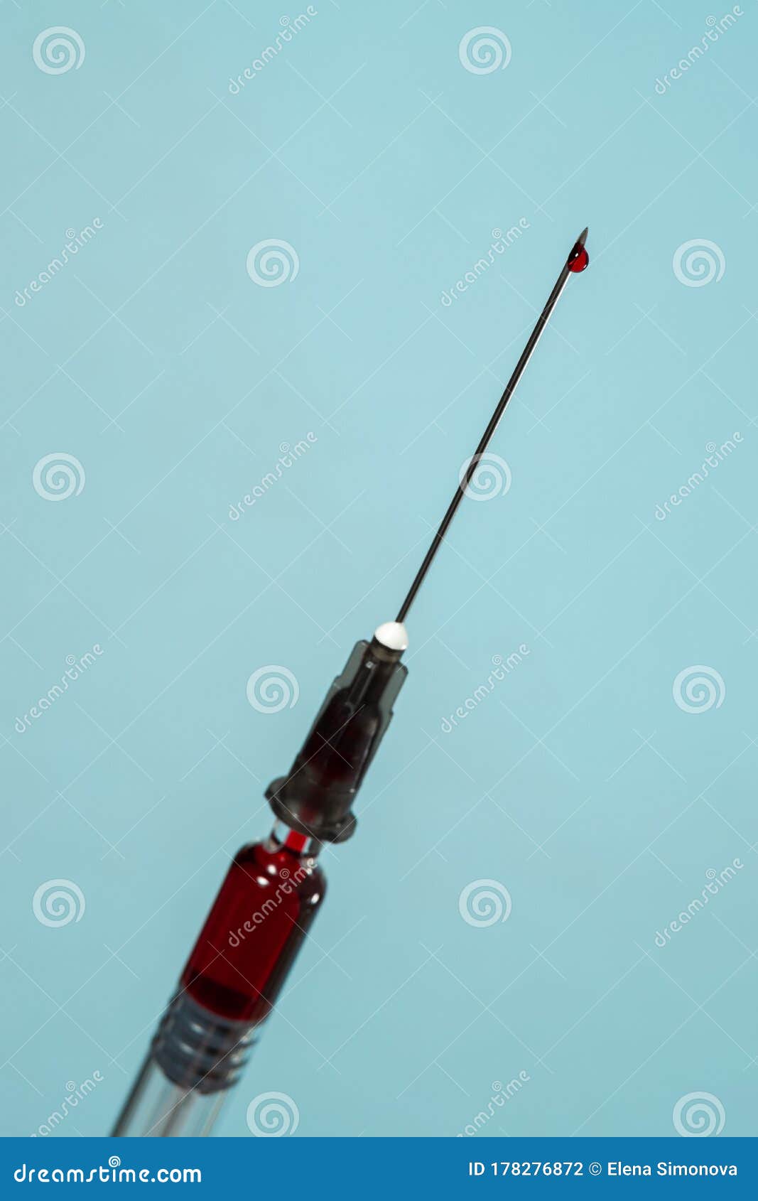Syringe with Red Liquid and Red Drop at the End of the Needle Stock ...