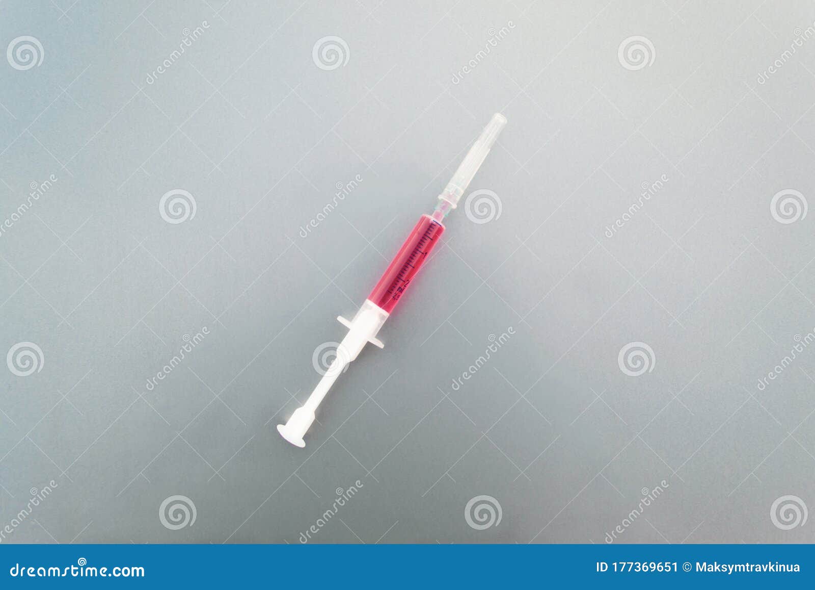 A syringe with red liquid stock image. Image of covid19 - 177369651