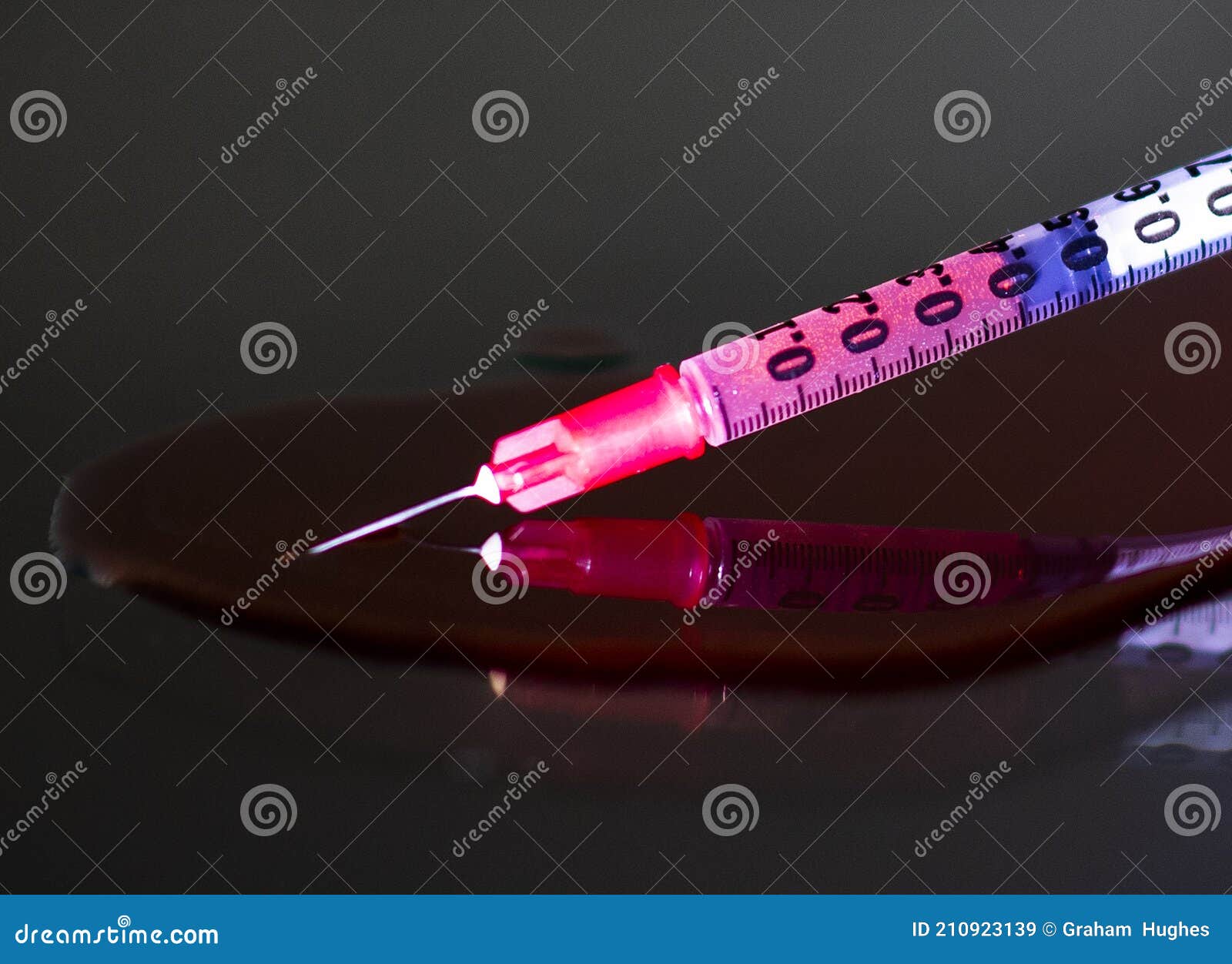 A Syringe Is Shown Dipped In Red Fluid Royalty-Free Stock Photo ...