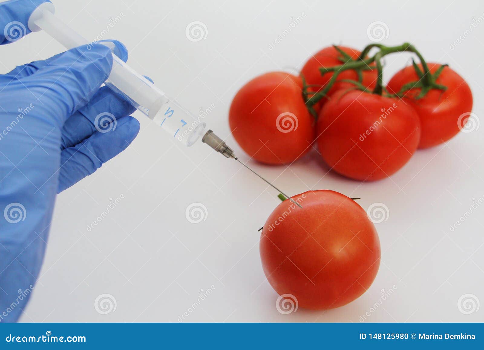 Syringe and Tomatoes. Genetically Modified Nutritional Concept Stock ...