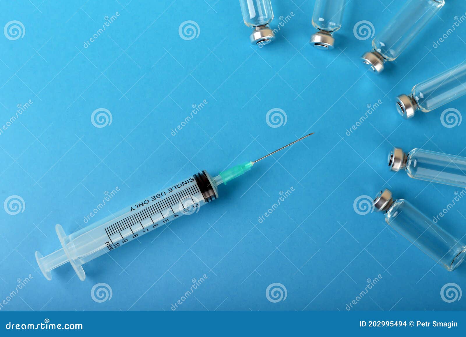 Syringe and Vial on Blue Background Stock Photo - Image of ...
