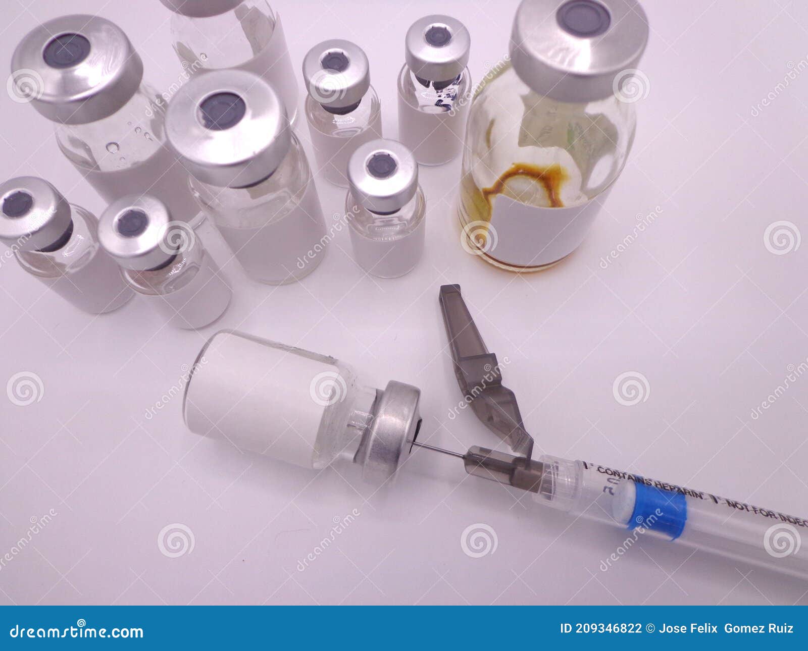 Syringe and vials stock photo. Image of bottle, chemistry - 209346822