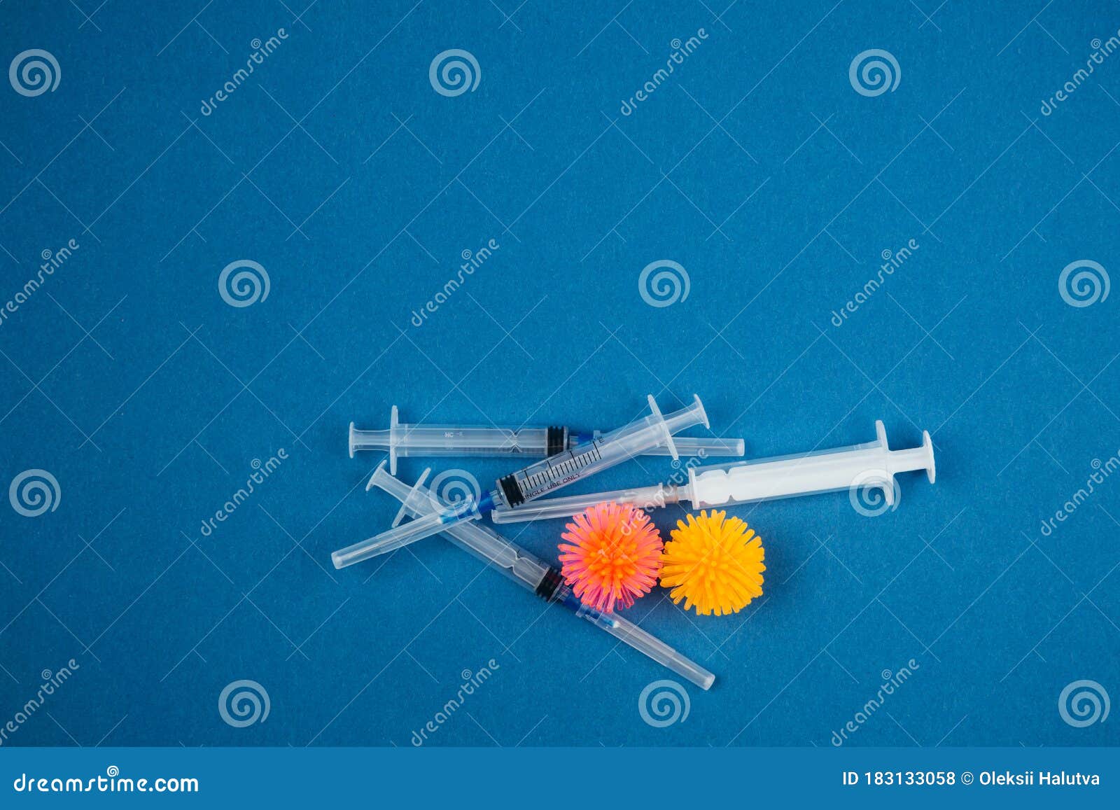 Syringes and Abstract Models of the -19 Virus on a Blue Background ...
