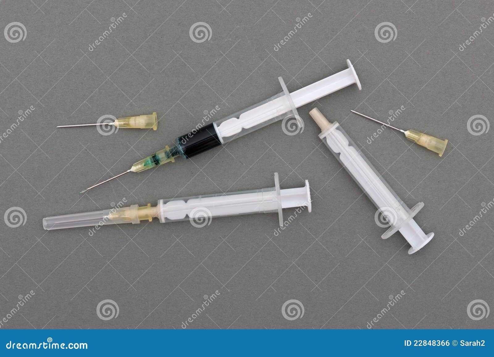 Syringes on Grey Background with Spare Needles Stock Photo - Image of ...