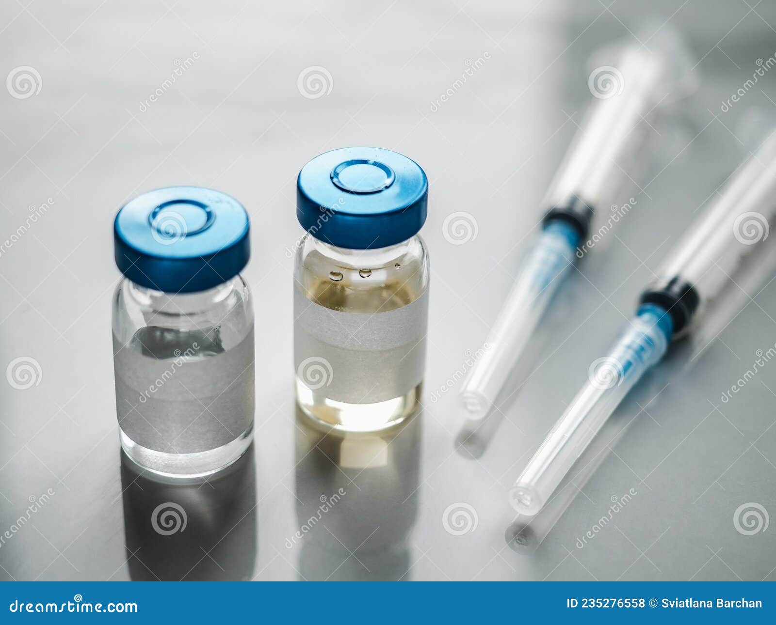 Syringes, Injection Bottles and Tablets Lying on the Table Stock Photo ...